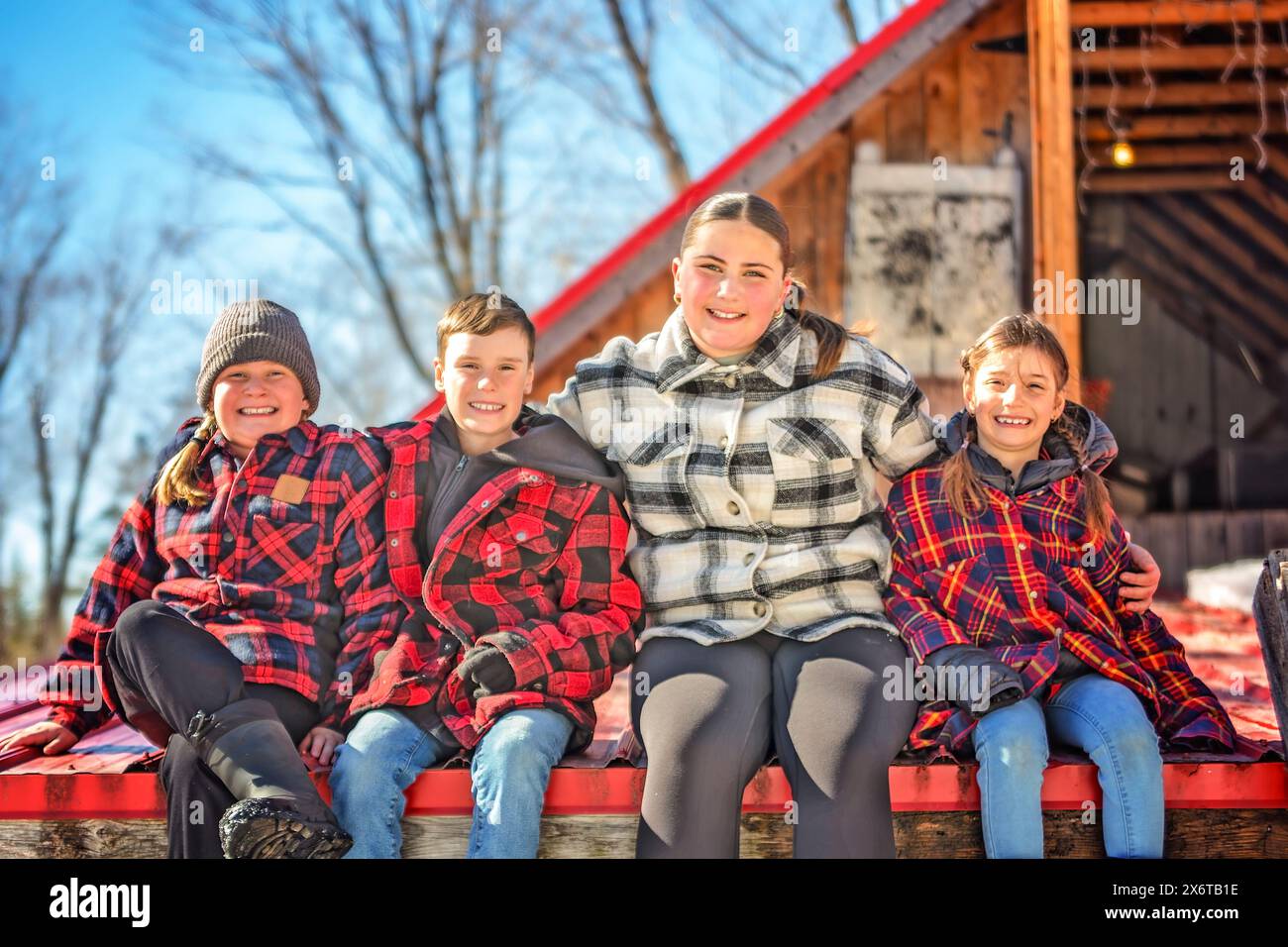 Photo showing children having great time at maple shack Stock Photo - Alamy