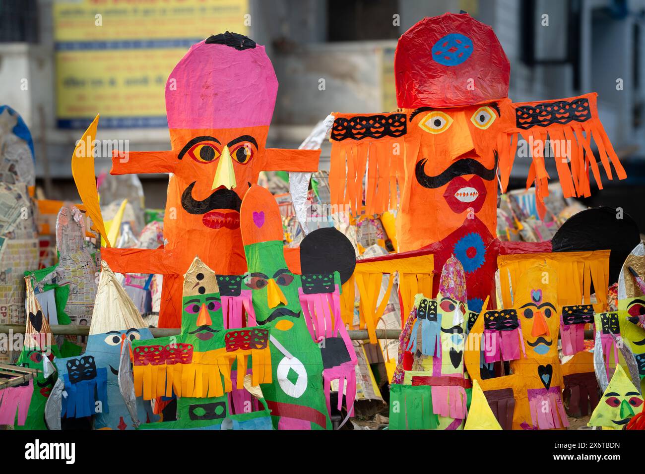 Multiple small colorful paper effigies of demon king ravan burnt on the ...