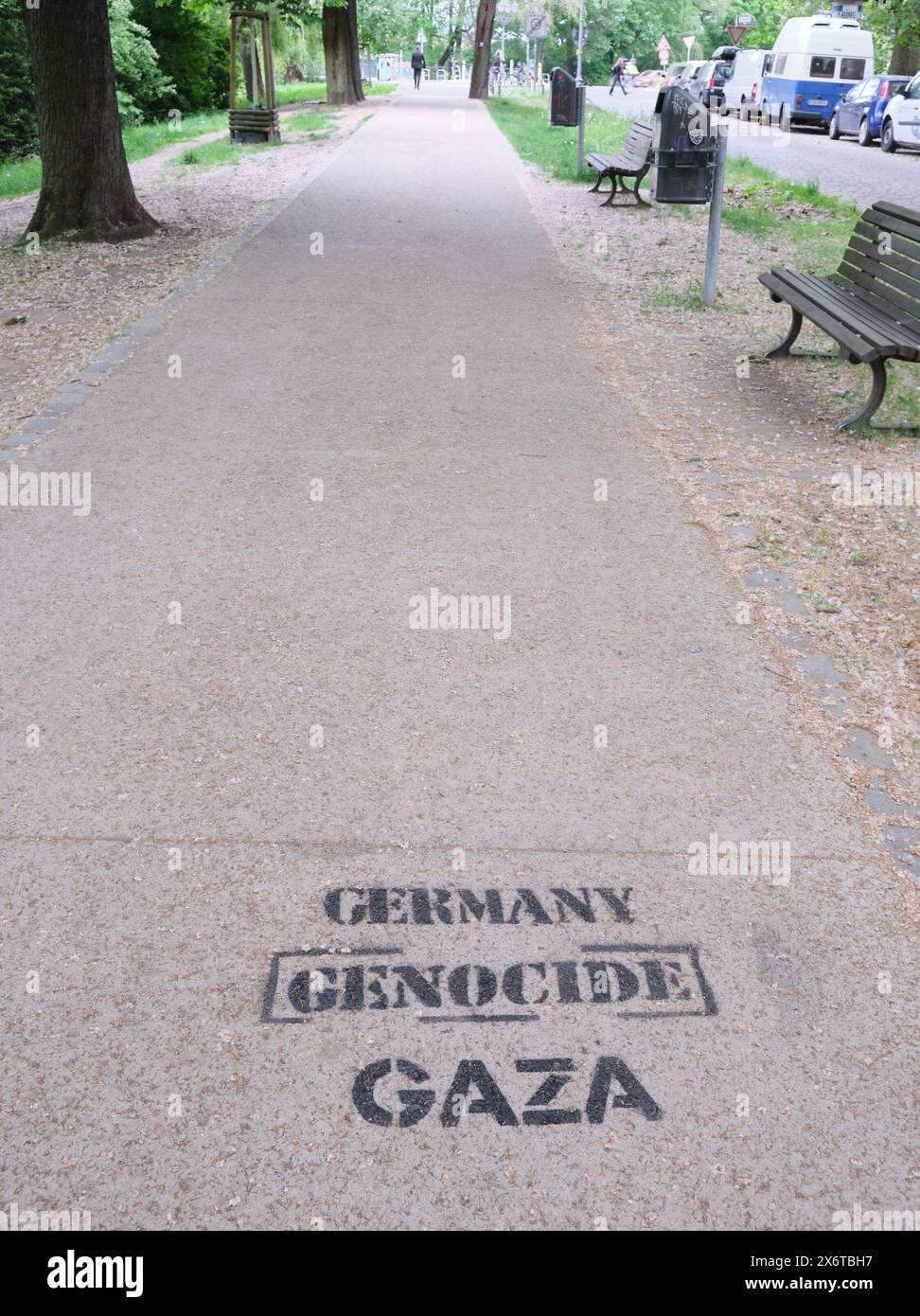 Berlin, Germany, May 7, 2024, Footpath in Kreuzberg with spray-painted ...