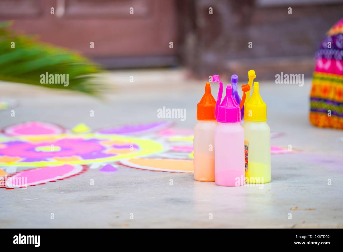 bottle of color powder used to make a rangoli a traditional art made on ...