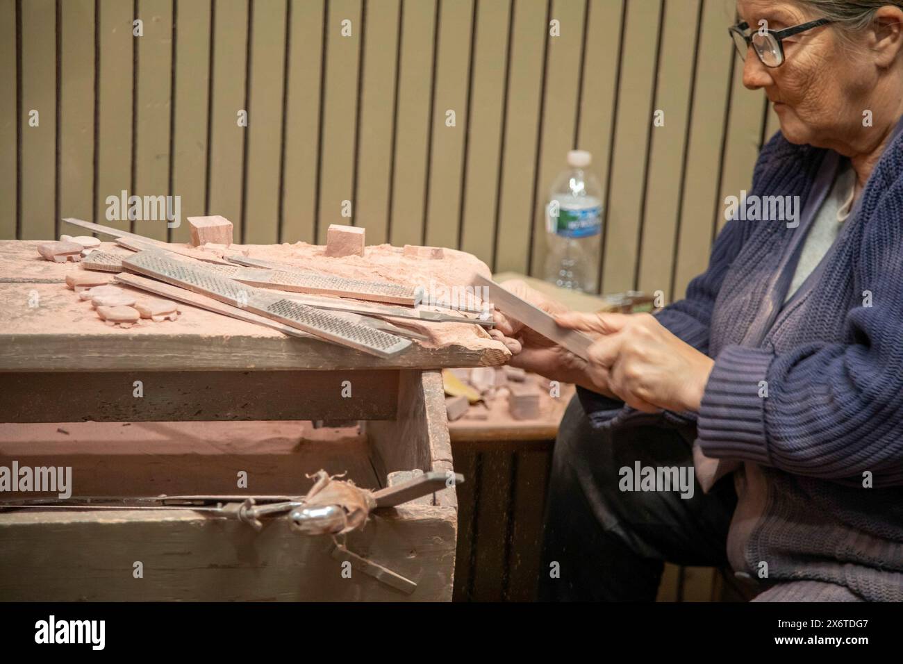 Pipestone, Minnesota - A Native American makes pipes from pipestone at ...