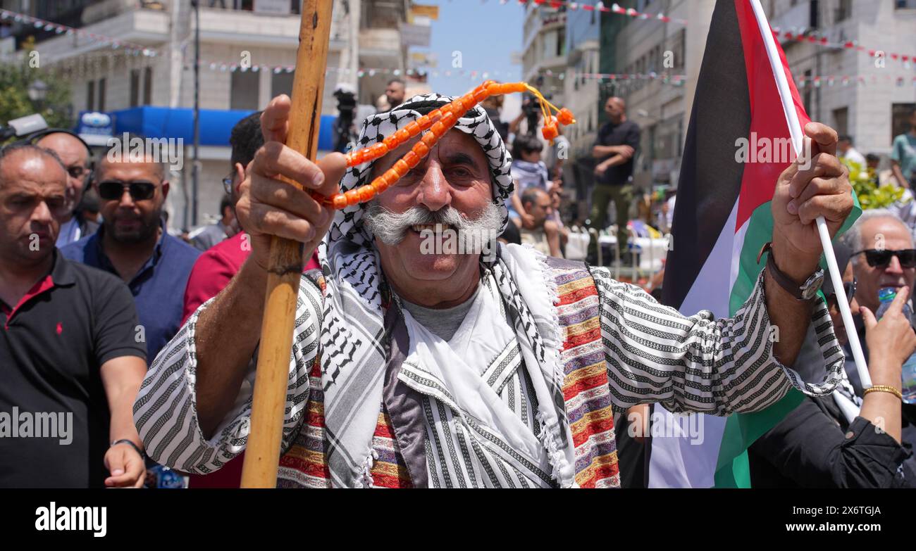 People putting up Palestinian flags march in Ramallah, West Bank on May ...