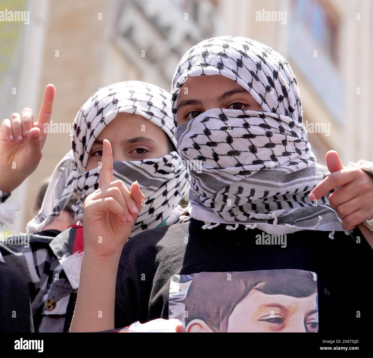 People putting up Palestinian flags march in Ramallah, West Bank on May ...