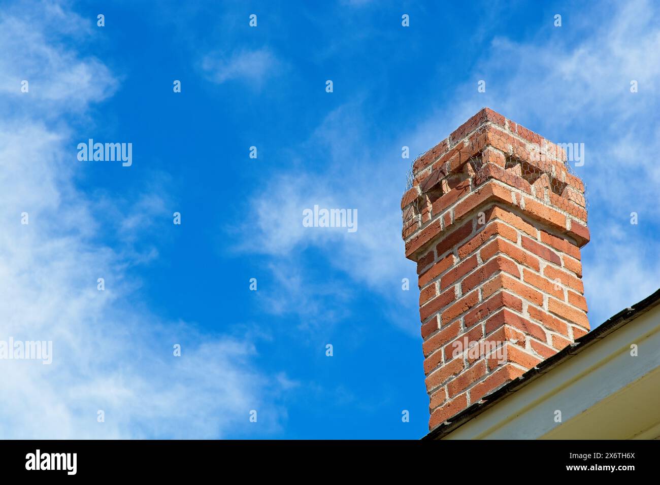 Red brick 19th century chimney against bright blue sky Stock Photo - Alamy