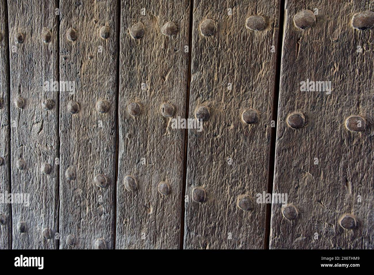 Wrought iron rivets in rough timber plank door Stock Photo - Alamy