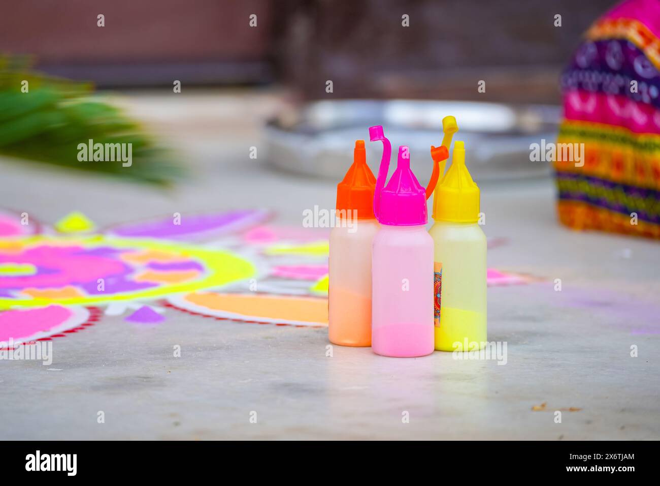 bottle of color powder used to make a rangoli a traditional art made on ...