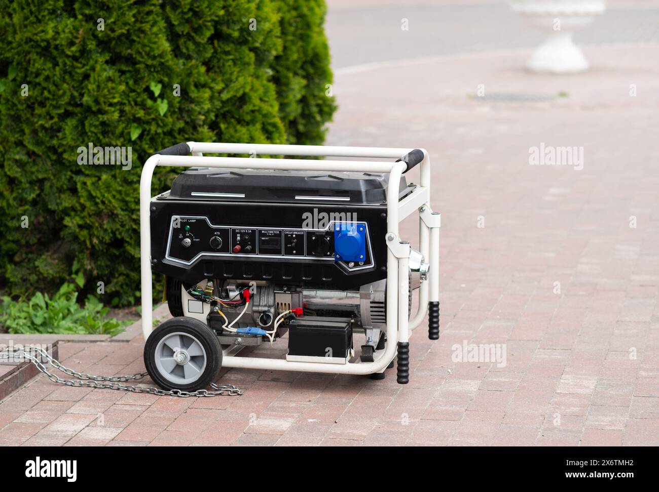 Power supply generator placed on street sidewalk. outdoor diesel power ...