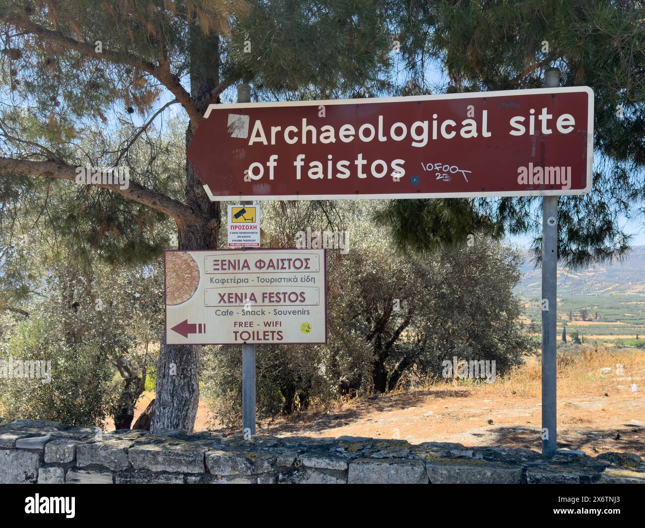 Tourist sign on archaeological site of Phaistos Palace excavation site ...