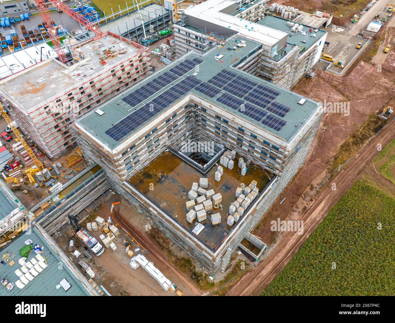 Construction site with buildings in shell construction and installed ...