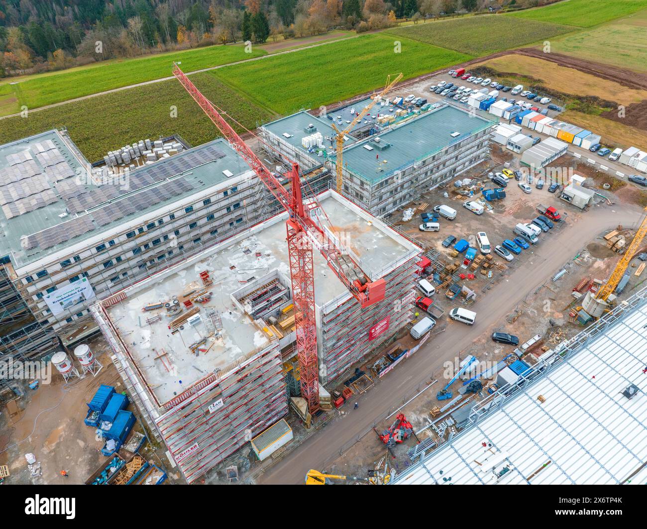 Large construction site with high cranes and unfinished buildings in a ...