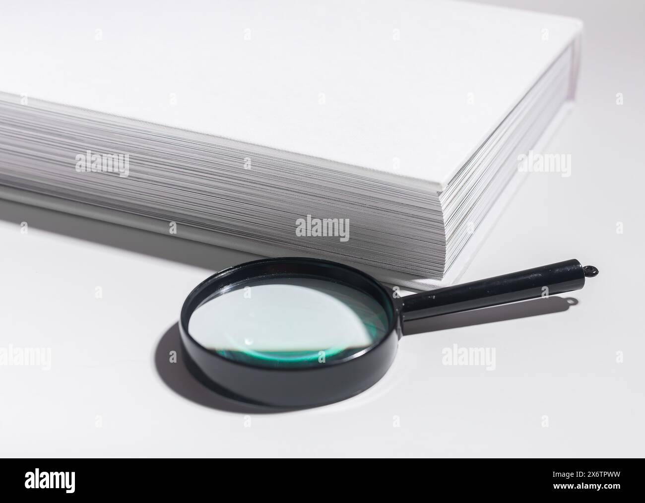 Office document magnification, magnifying glass on paper. Business ...