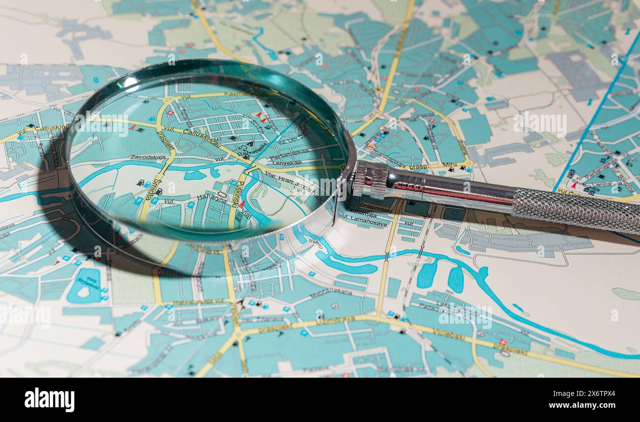 Travel map with magnifying glass, searching city locations. Geography ...