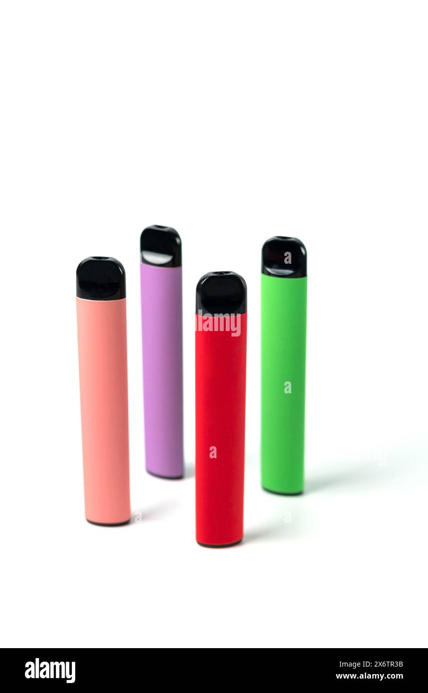 disposable electronic cigarettes of different flavors on a white ...