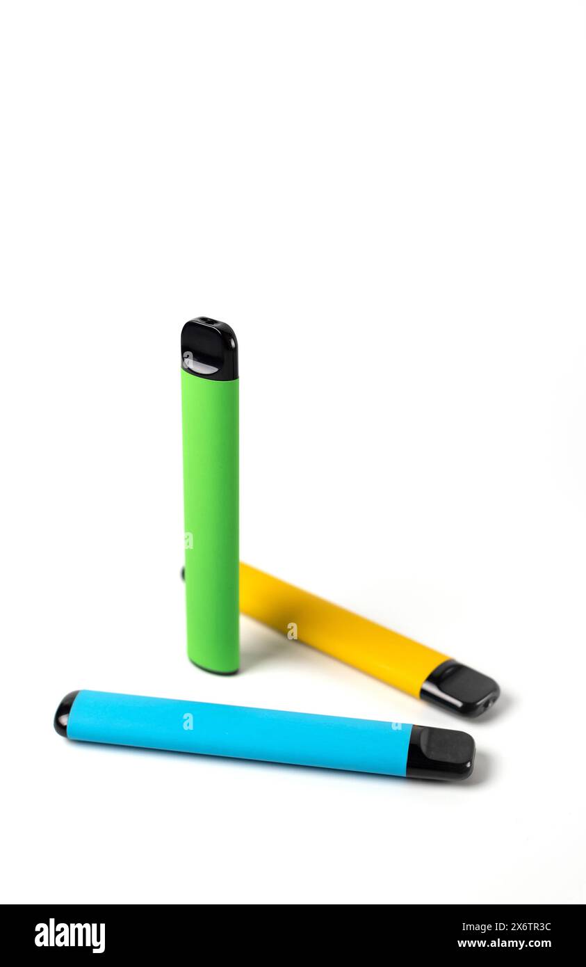 disposable electronic cigarettes of different flavors on a white ...