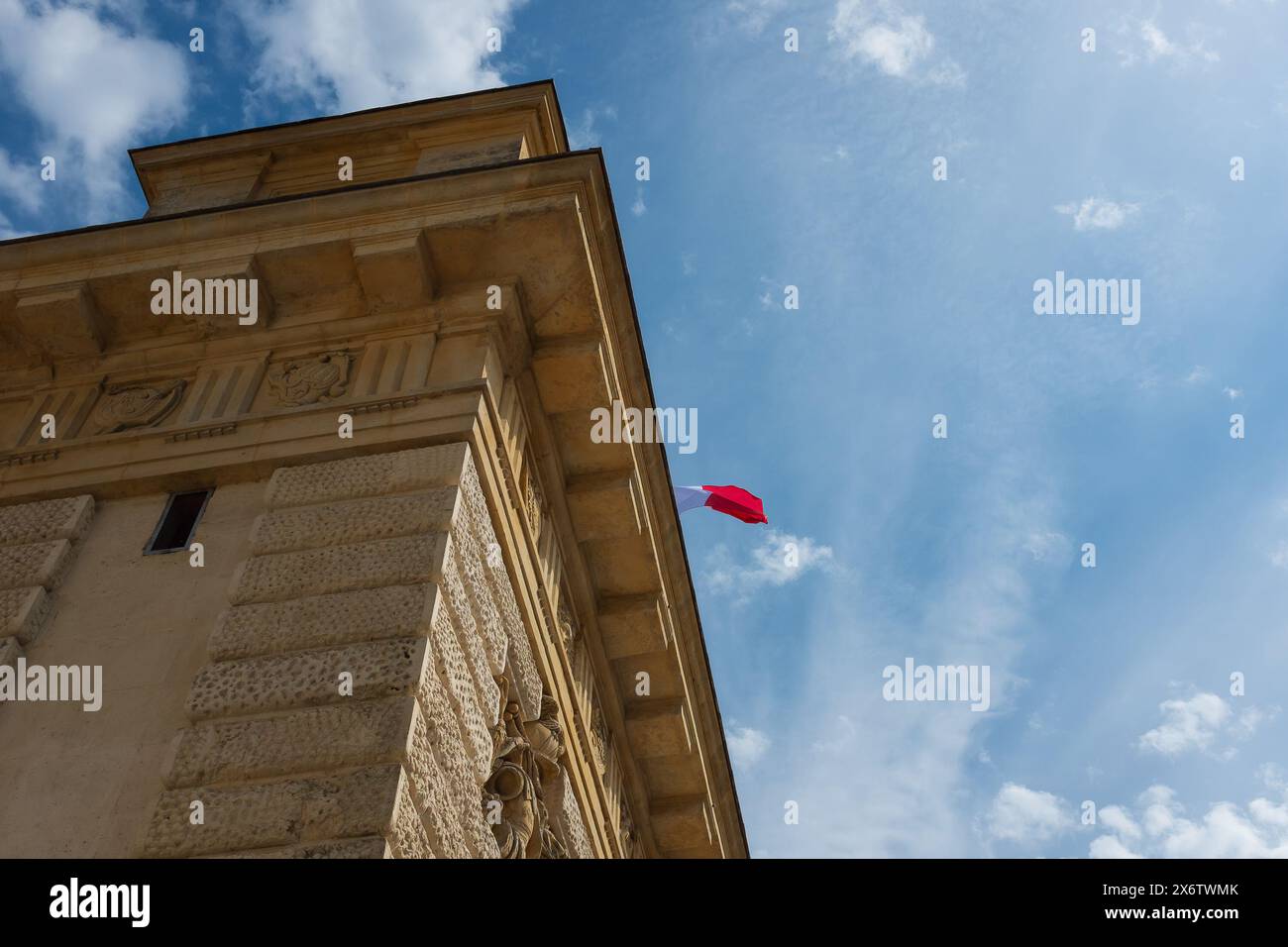 The French flag floating on top of the Arch of Triumph, in Montpellier ...