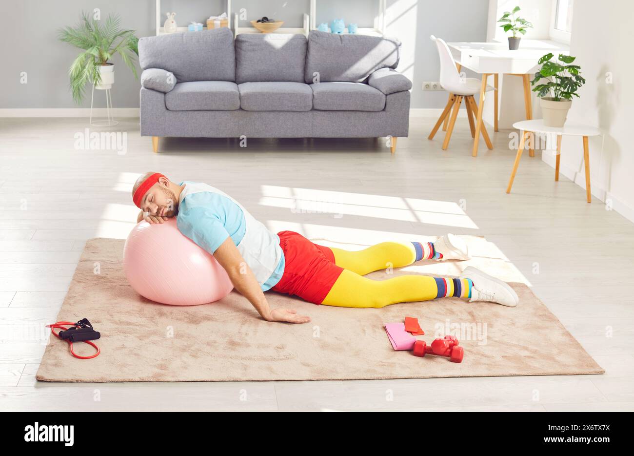 Funny lazy tired man sleeping during workout and resting his head on ...