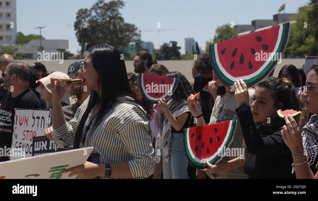 Israeli Arab students hold signs in the colors of the Palestinian flag ...