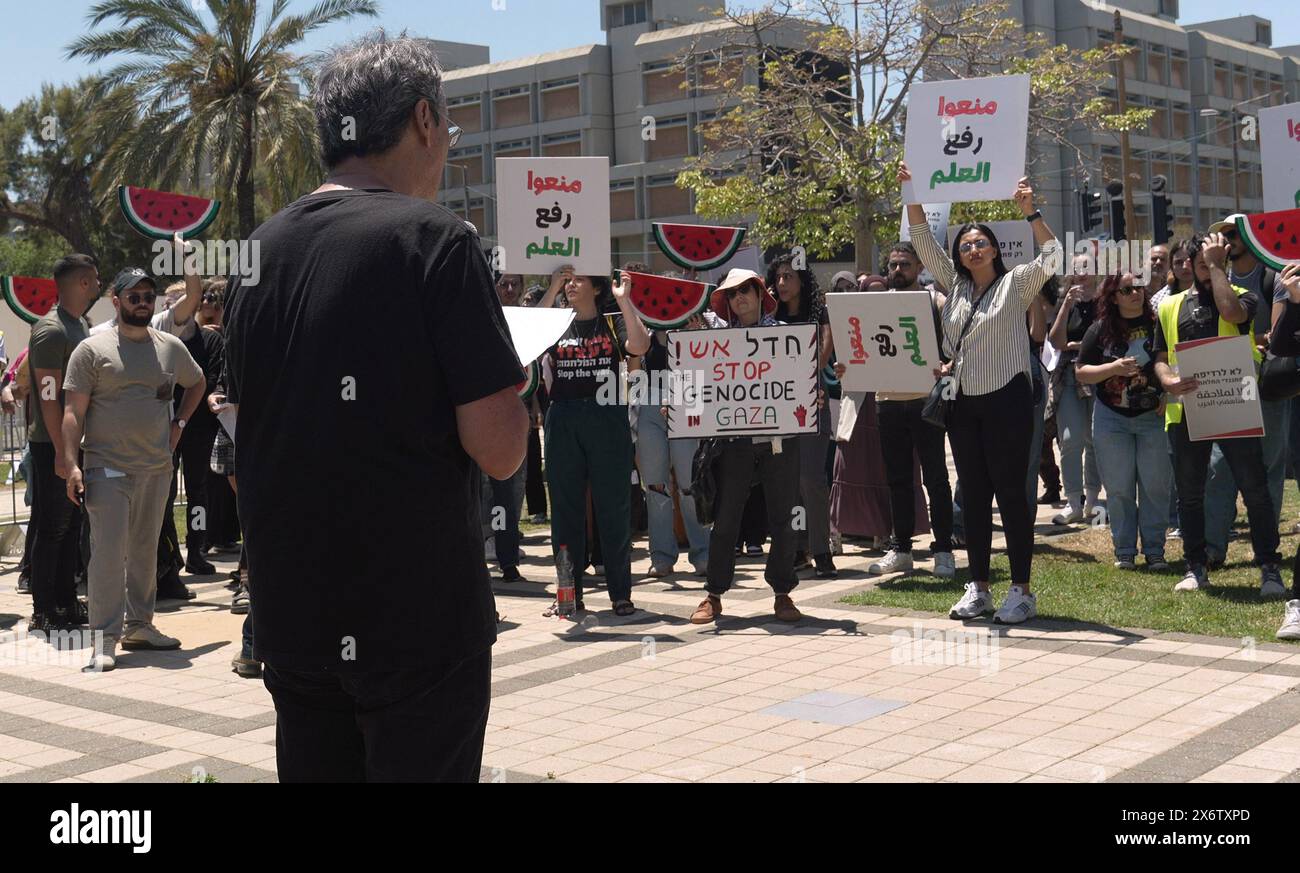 Israeli Arab students hold signs in the colors of the Palestinian flag ...