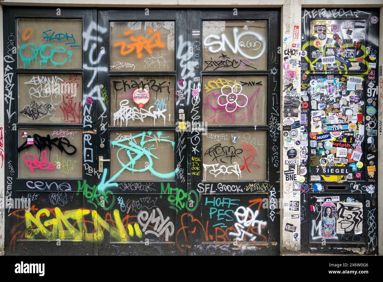 business entrance full of graffiti and stickers, Amsterdam, Netherlands ...