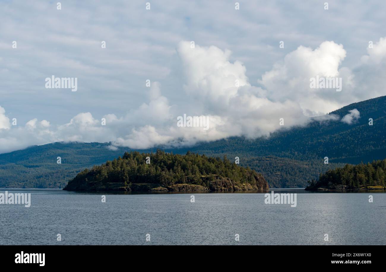 Forested mountains and islands in the beautiful coastal landscape of ...