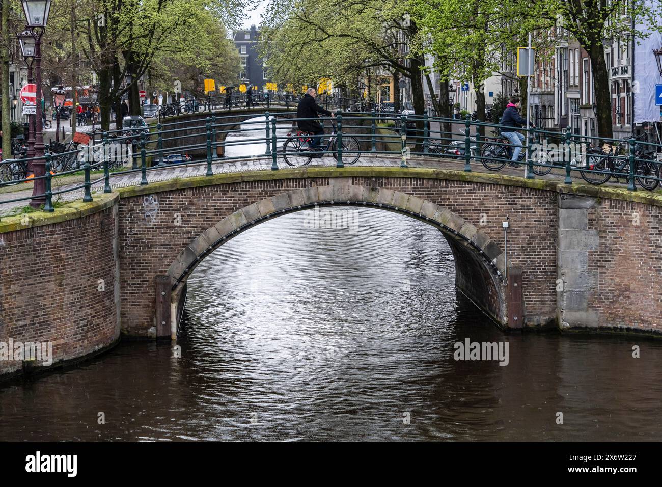 typical bridge crossing Keizersgracht water canal, Amsterdam ...