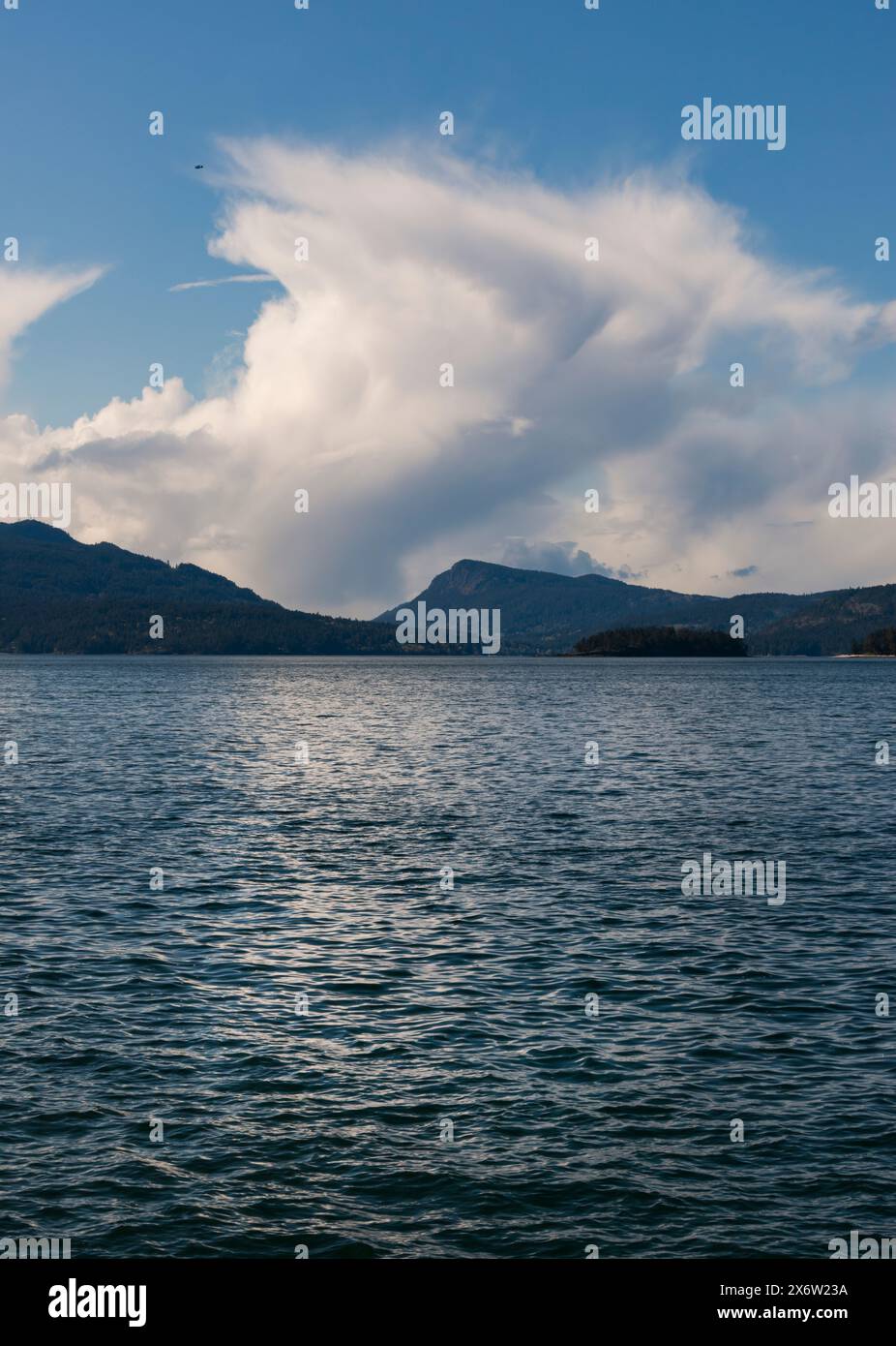 Dramatic spring storm clouds above the coastal mountain landscape in ...