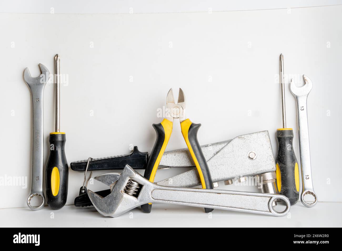 construction tool kit on white background, pliers, screwdriver, wrench ...