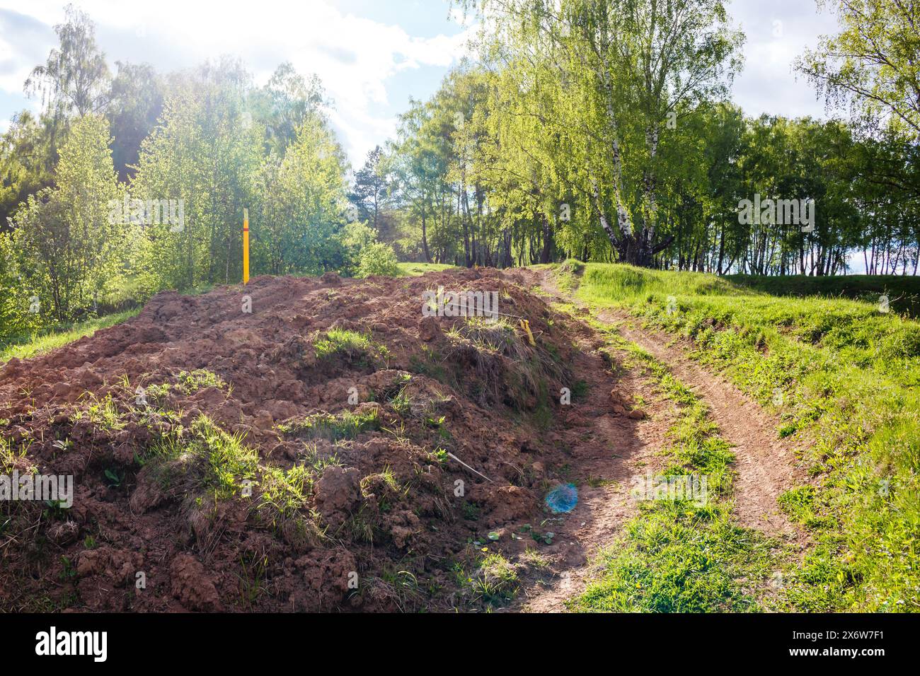 Dug up earth in a picturesque area after laying a gas pipeline ...