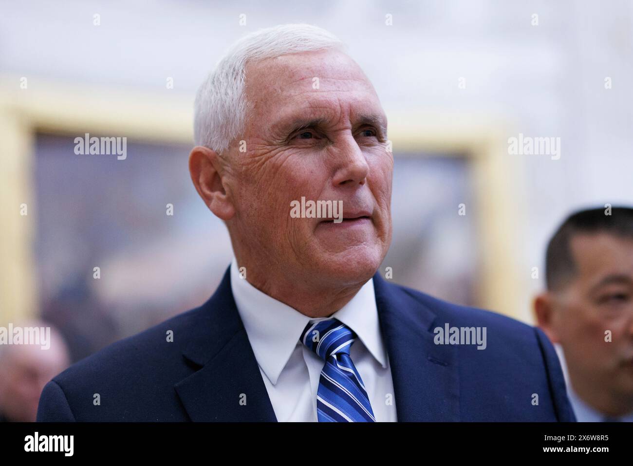 Former US Vice President Mike Pence walks through the Rotunda of the US ...