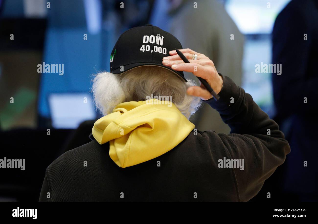 New York, United States. 16th May, 2024. A trader wears a baseball cap ...