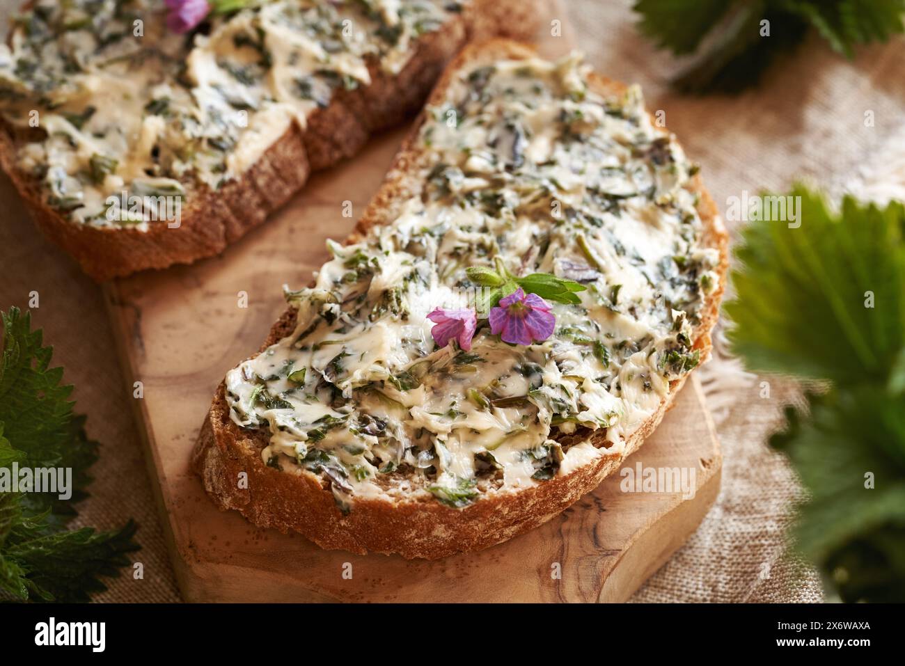A slice of sourdough bread with nettle butter Stock Photo - Alamy