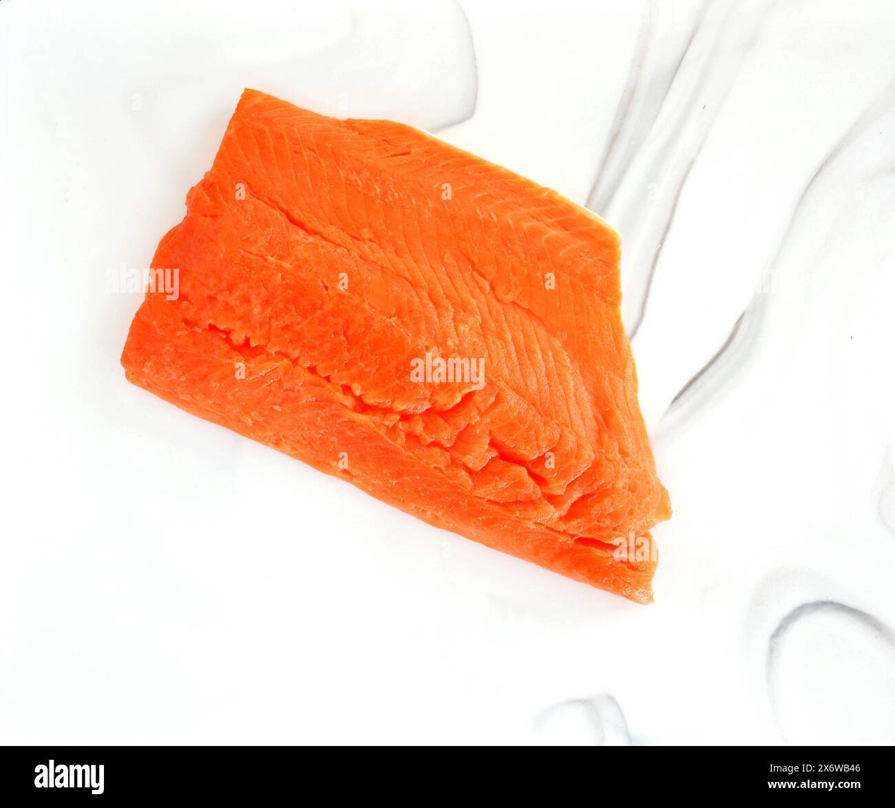 Fresh caught Pacific Ocean coho salmon filet in flat lay composition ...