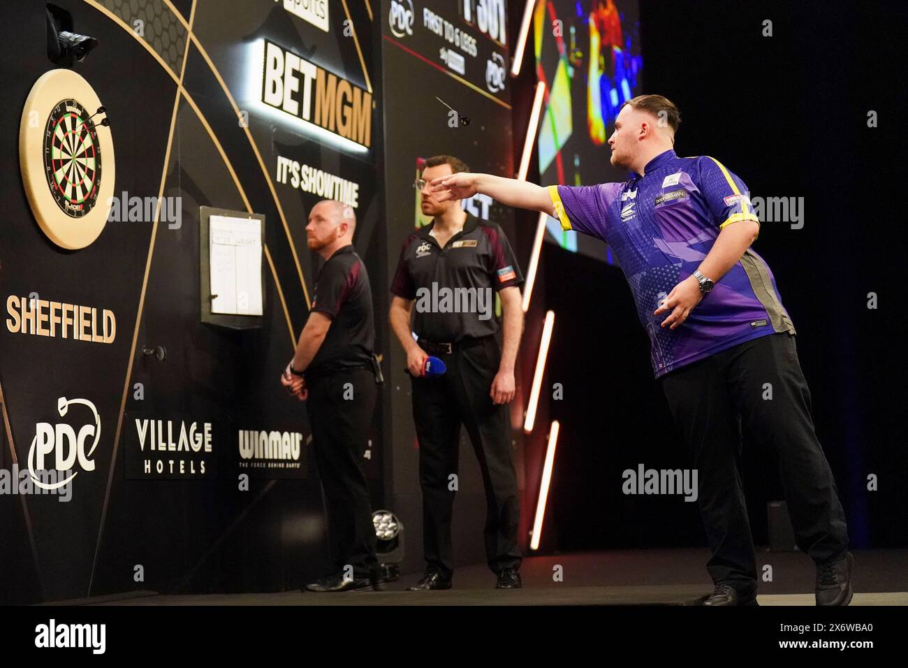 Sheffield, UK. 16th May, 2024. Luke Littler throws at the dart board ...
