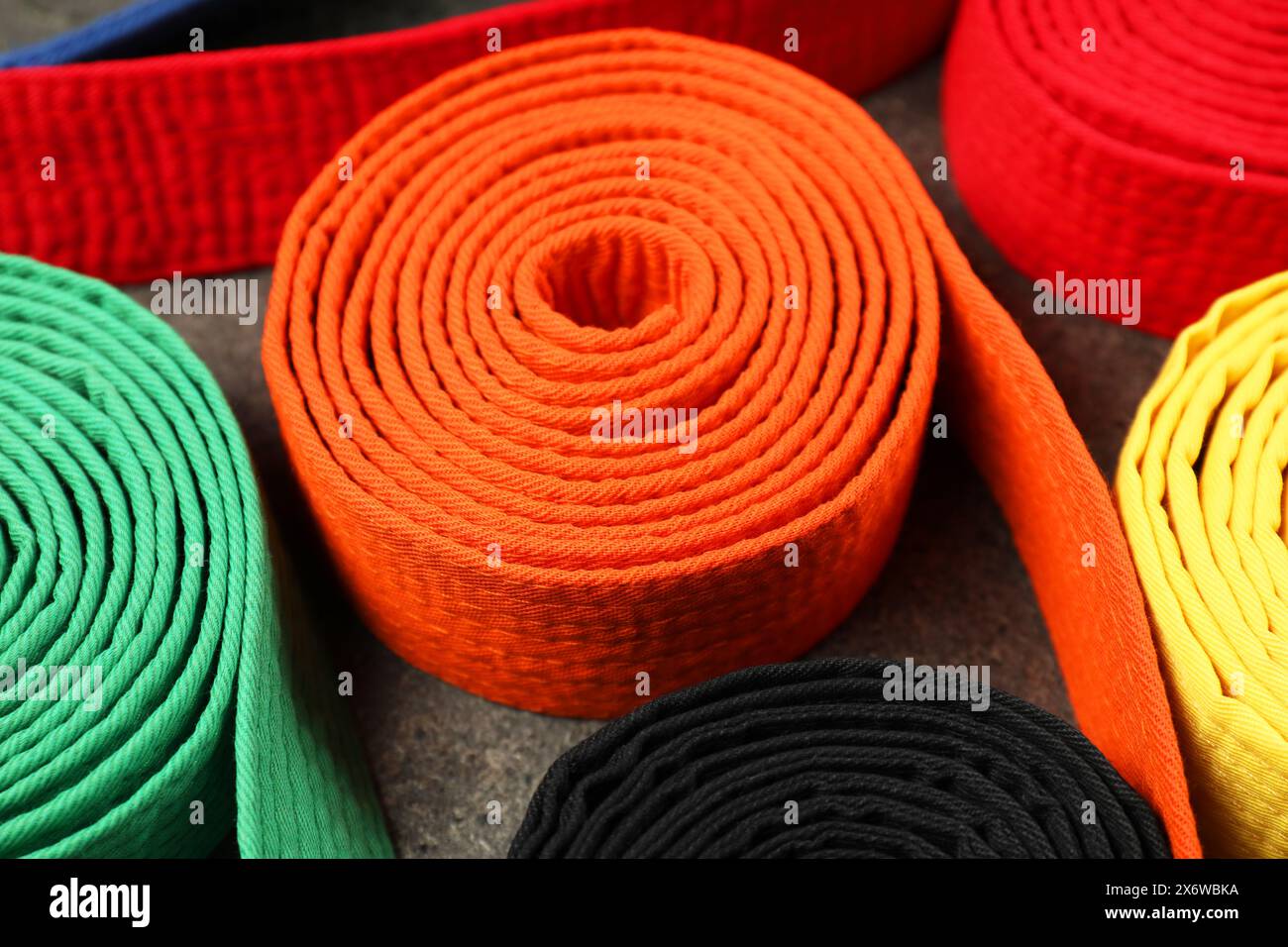 Colorful karate belts, closeup. Martial arts uniform Stock Photo - Alamy