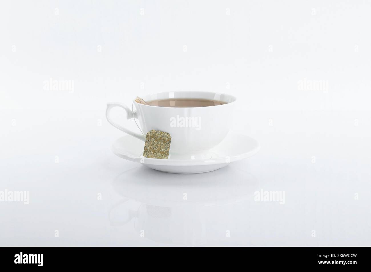 Tasty tea in cup on white background Stock Photo - Alamy
