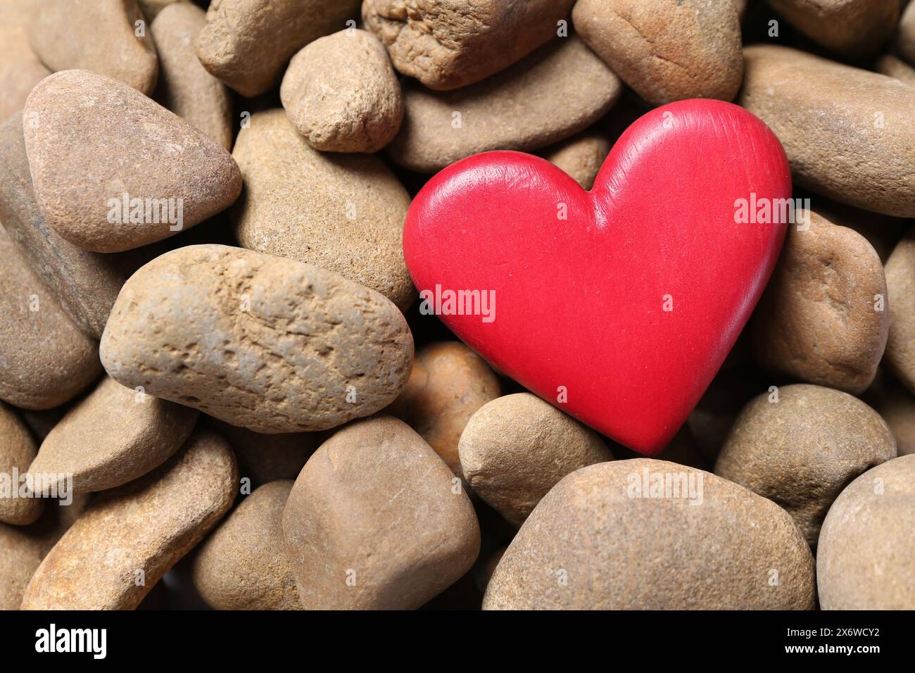 Red decorative heart on stones, top view Stock Photo - Alamy