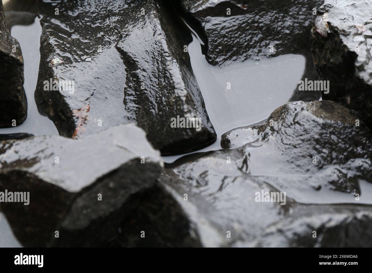 Beautiful pebbles in water as background, closeup Stock Photo - Alamy