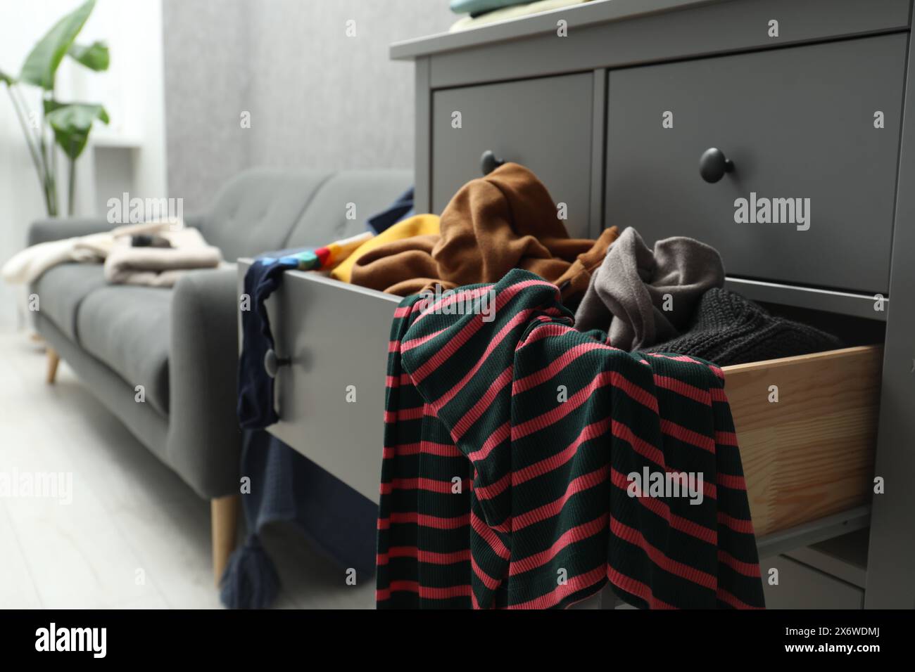 Cluttered room. Clothes in mess all around place Stock Photo - Alamy