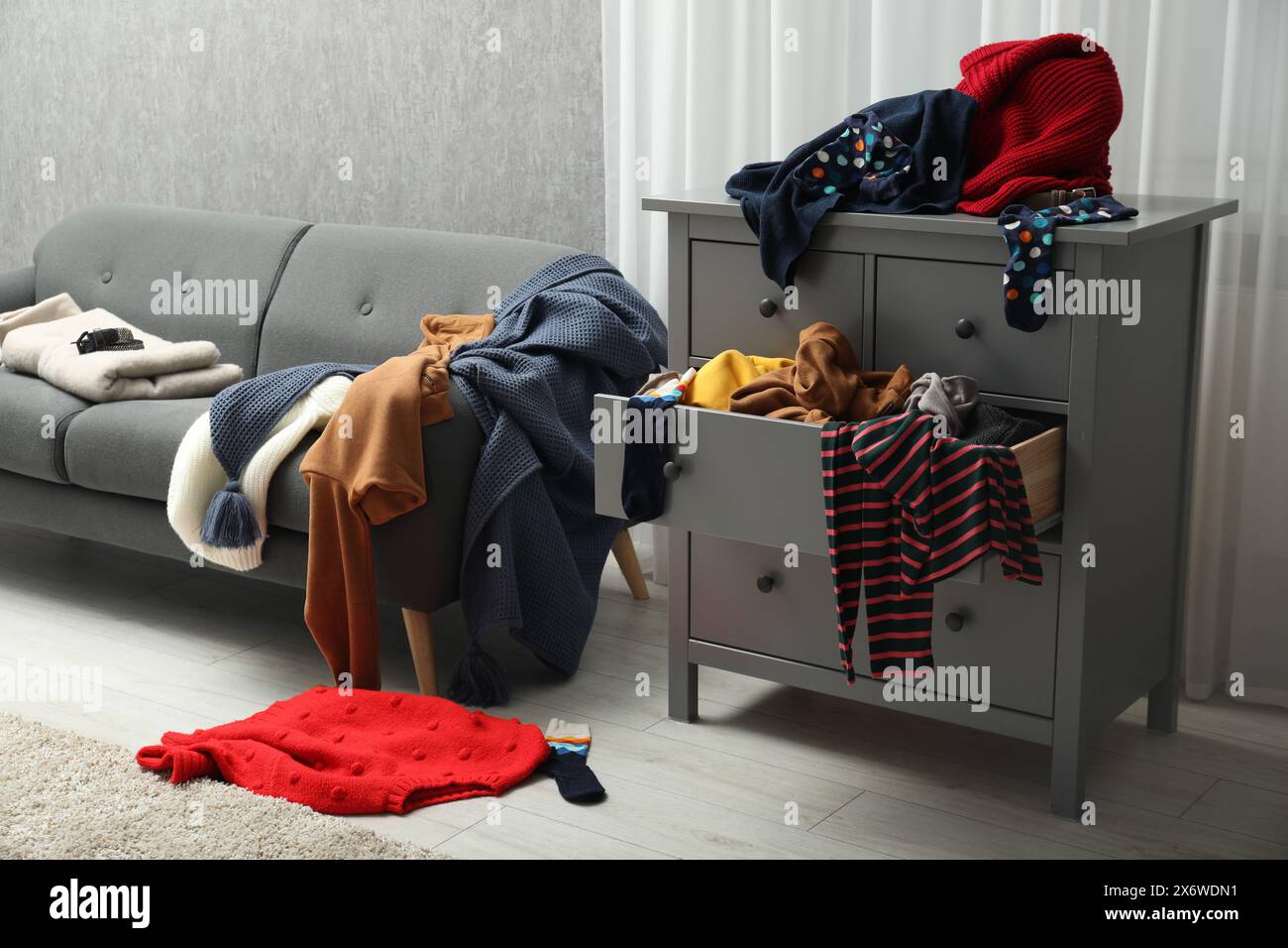 Cluttered room. Clothes in mess all around place Stock Photo - Alamy