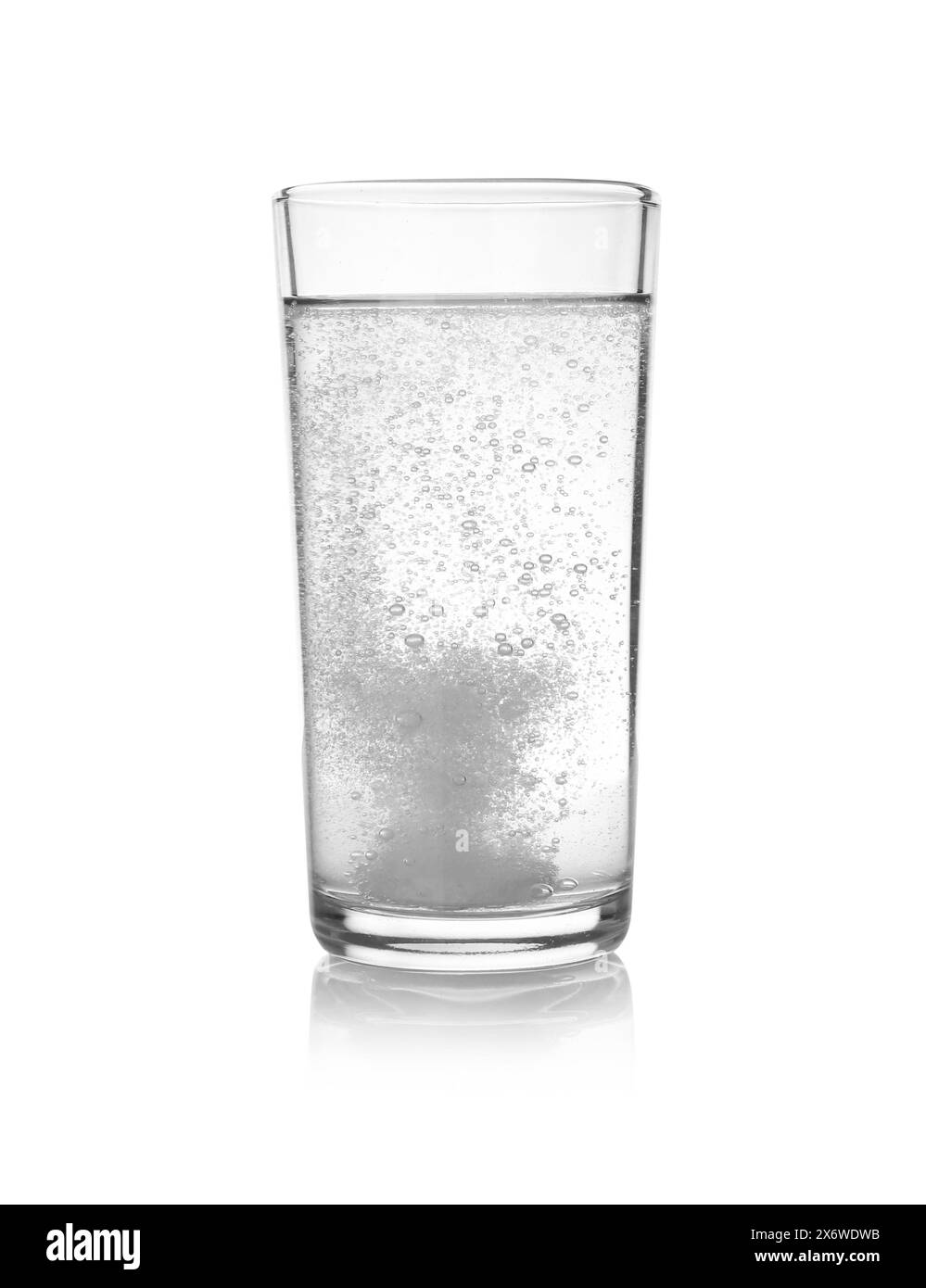 Effervescent pill dissolving in glass of water isolated on white Stock ...