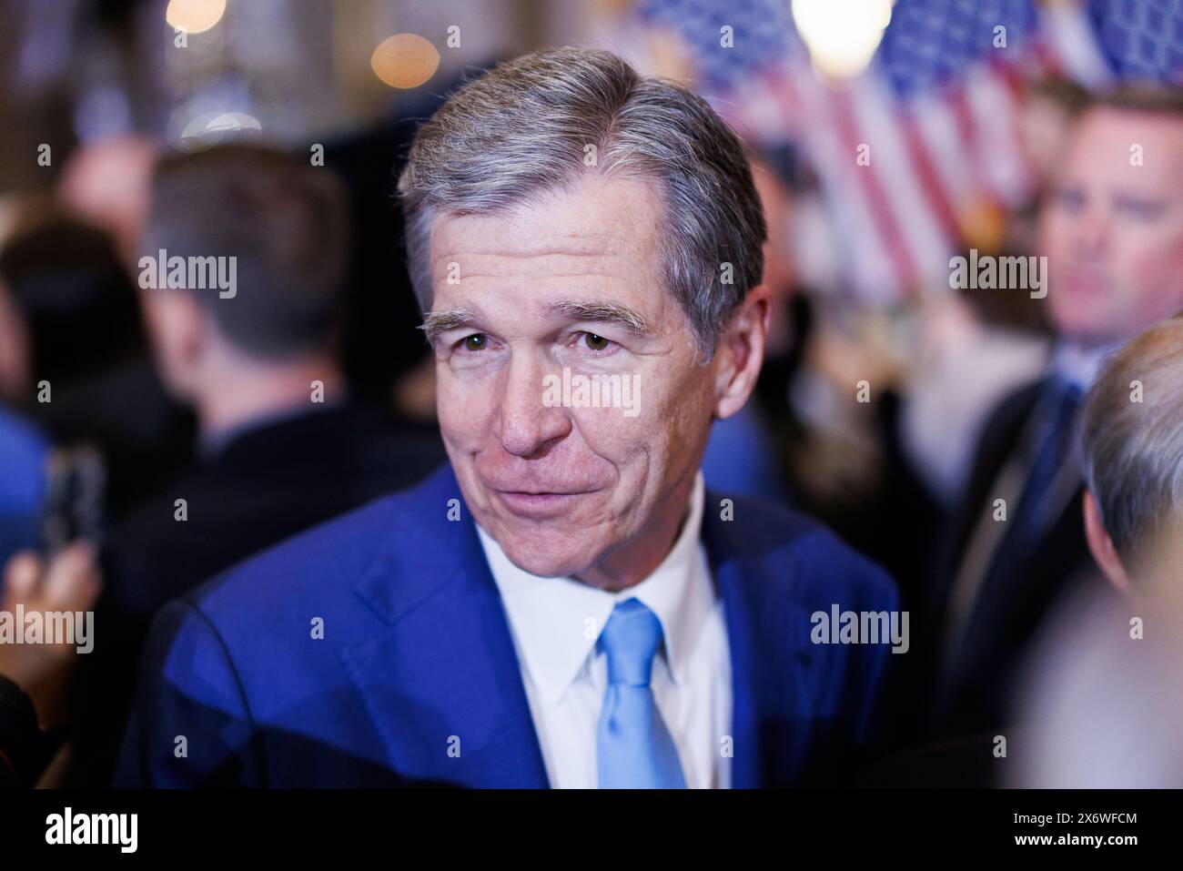 Governor Roy Cooper (Democrat of North Carolina) speaks with guests ...