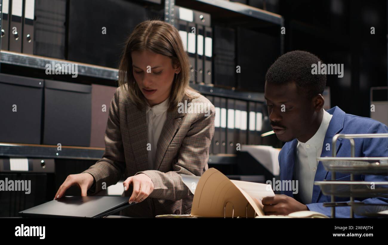 Policewoman with rucksack enters office with african american ... Policewoman with rucksack enters office with african american ...