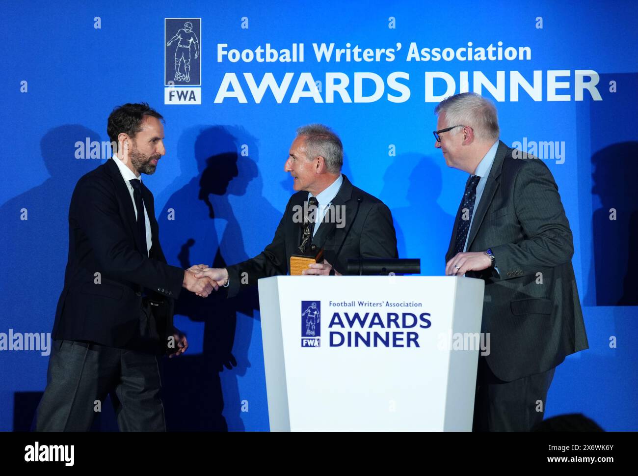 England manager Gareth Southgate (left) presenting the FWA Men's ...