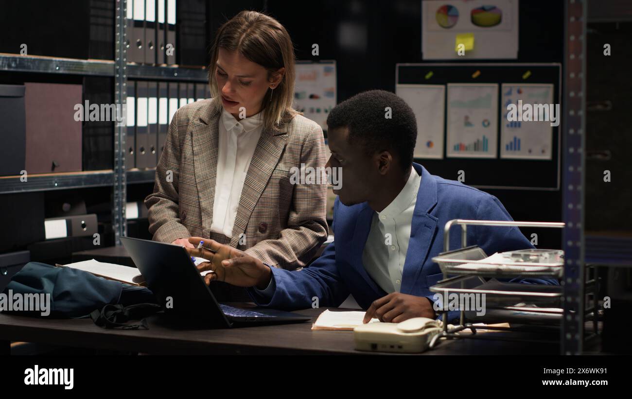 African american and caucasian police officers conduct extensive ...