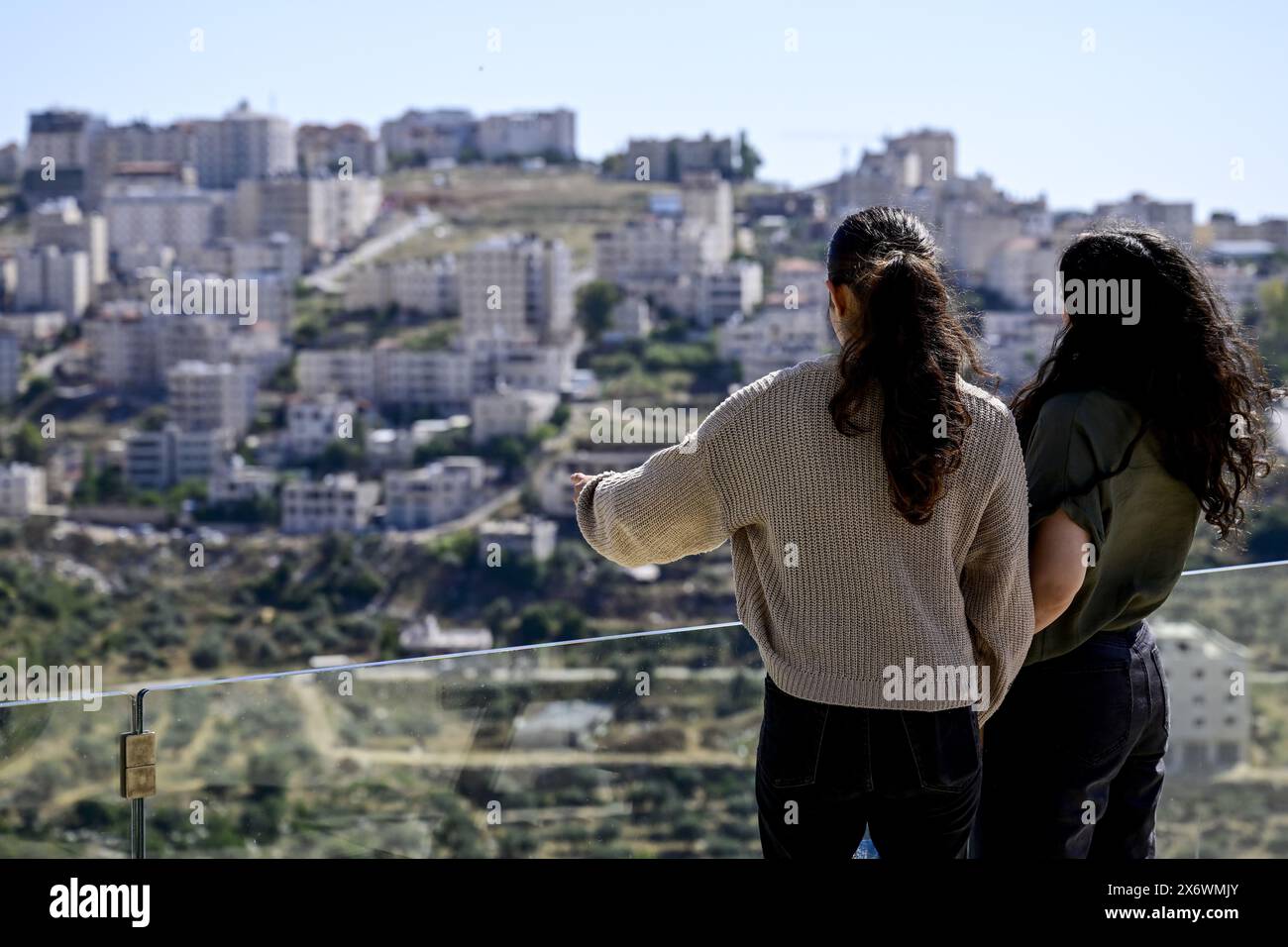 Ramallah, Palestinian Territory. 16th May, 2024. Girls looking out over ...