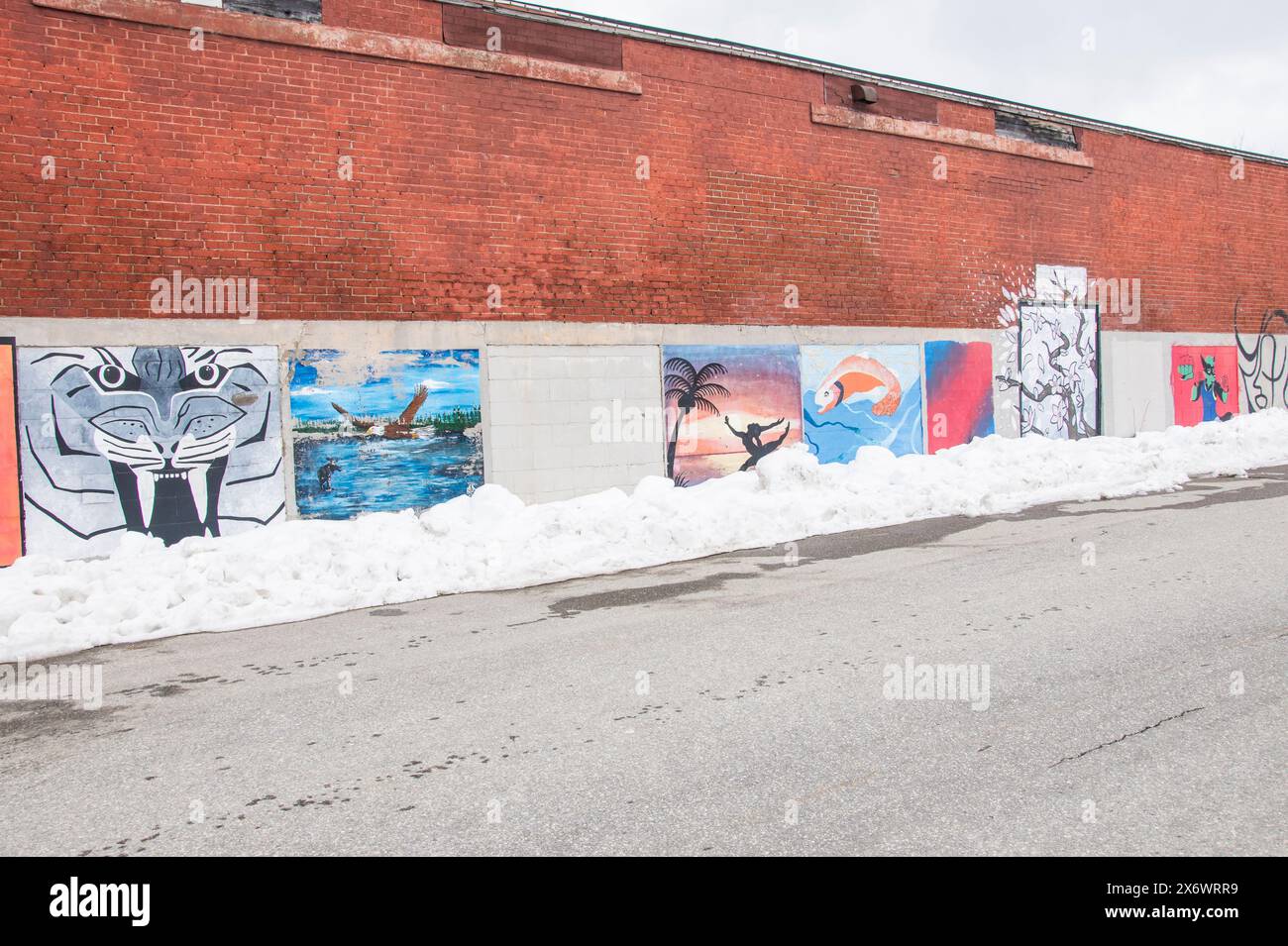 Various murals on the Eastside Creative Centre building in Miramichi ...