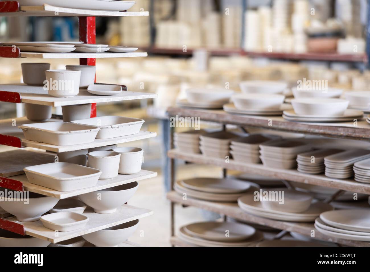 Ceramic dishes blanks on factory rack Stock Photo - Alamy