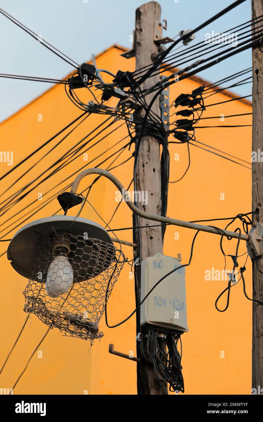 283 Complex set of electrical cables attached to a wooden utility pole ...