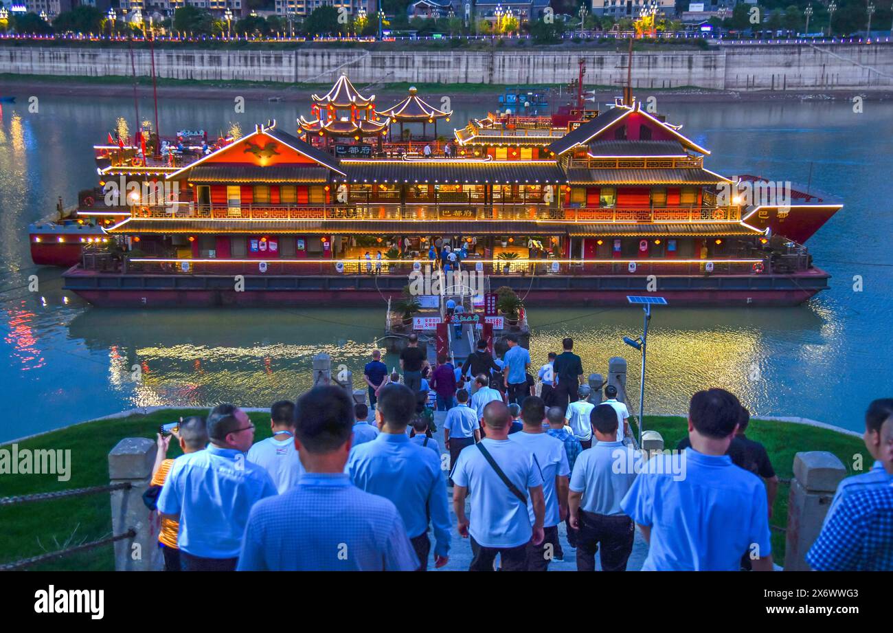 CHONGQING, CHINA - MAY 15, 2024 - Tourists board a boat for a night ...