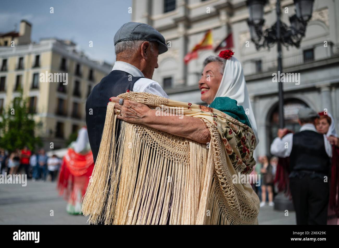 Mature dancers dance the traditional chotis during the San Isidro ...